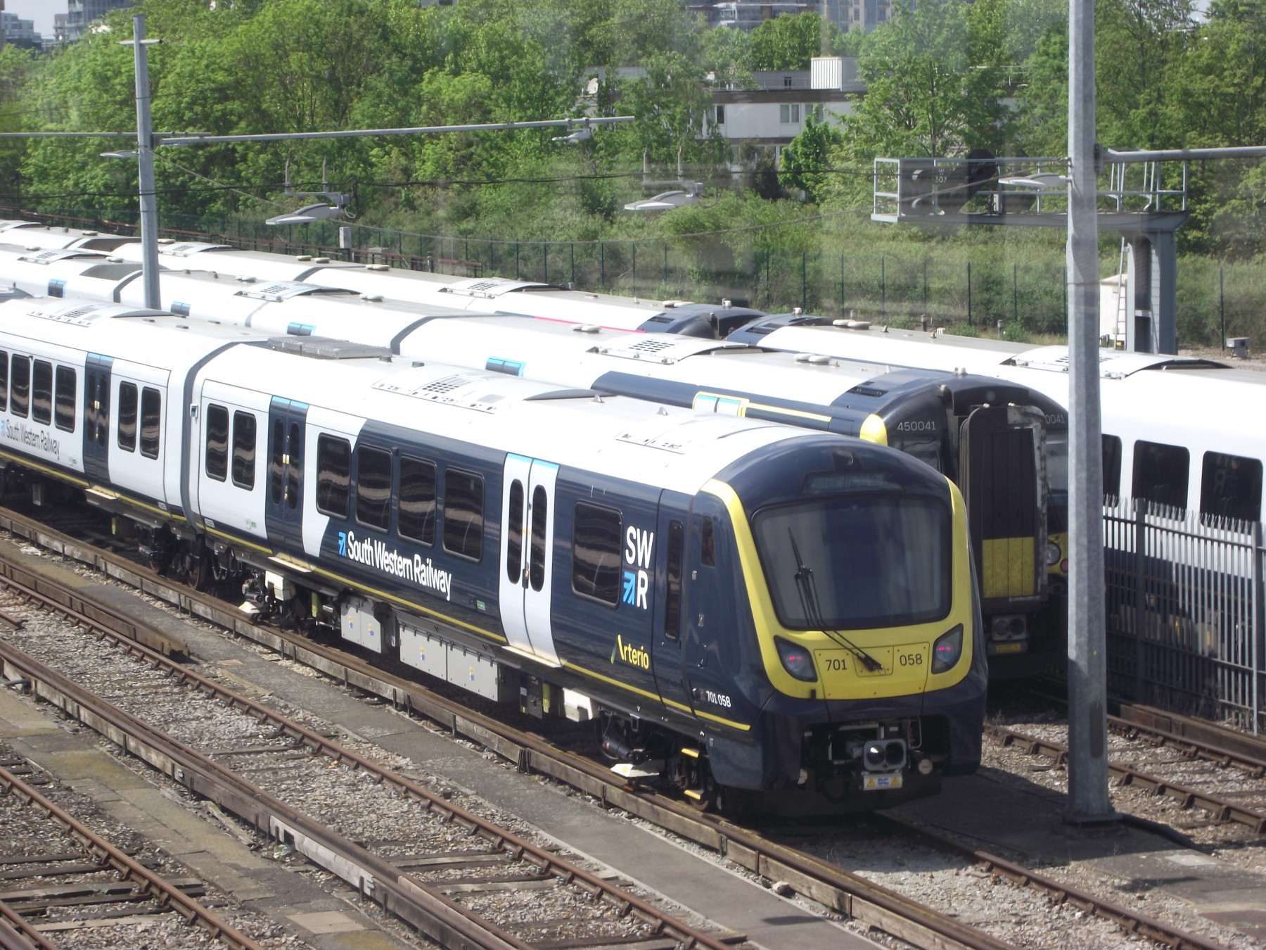 Photo of 701058 and 450041 at Clapham Junction Depot — trainlogger